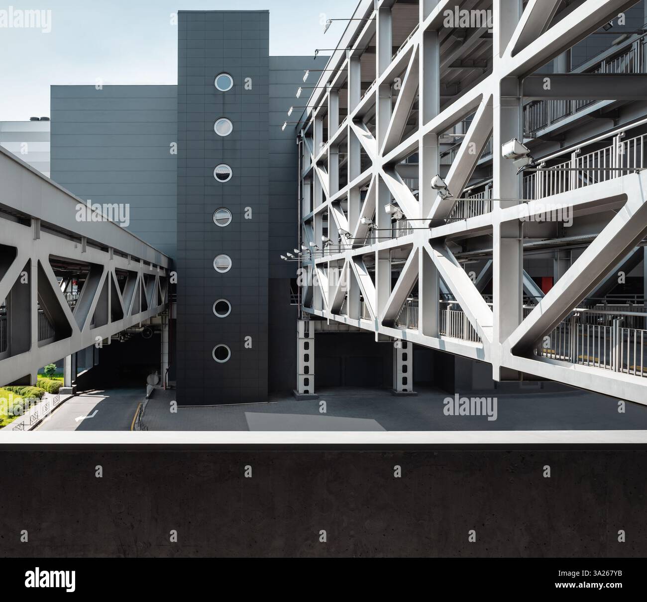 Modern building in industrial area. Multi-storey bridge connecting two ...