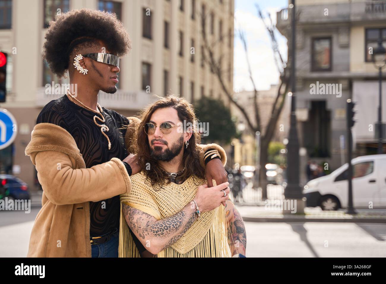 Two androgynous people embracing on a city street, showcasing their ...