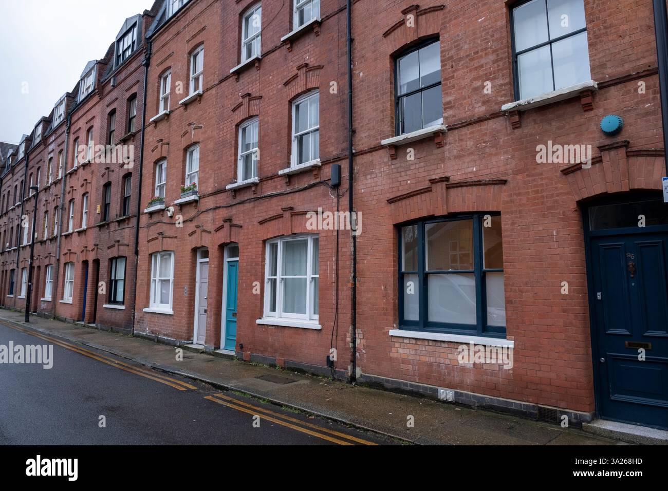 Victorian terraced red brick housing on Halcrow Street in Whitechapel ...