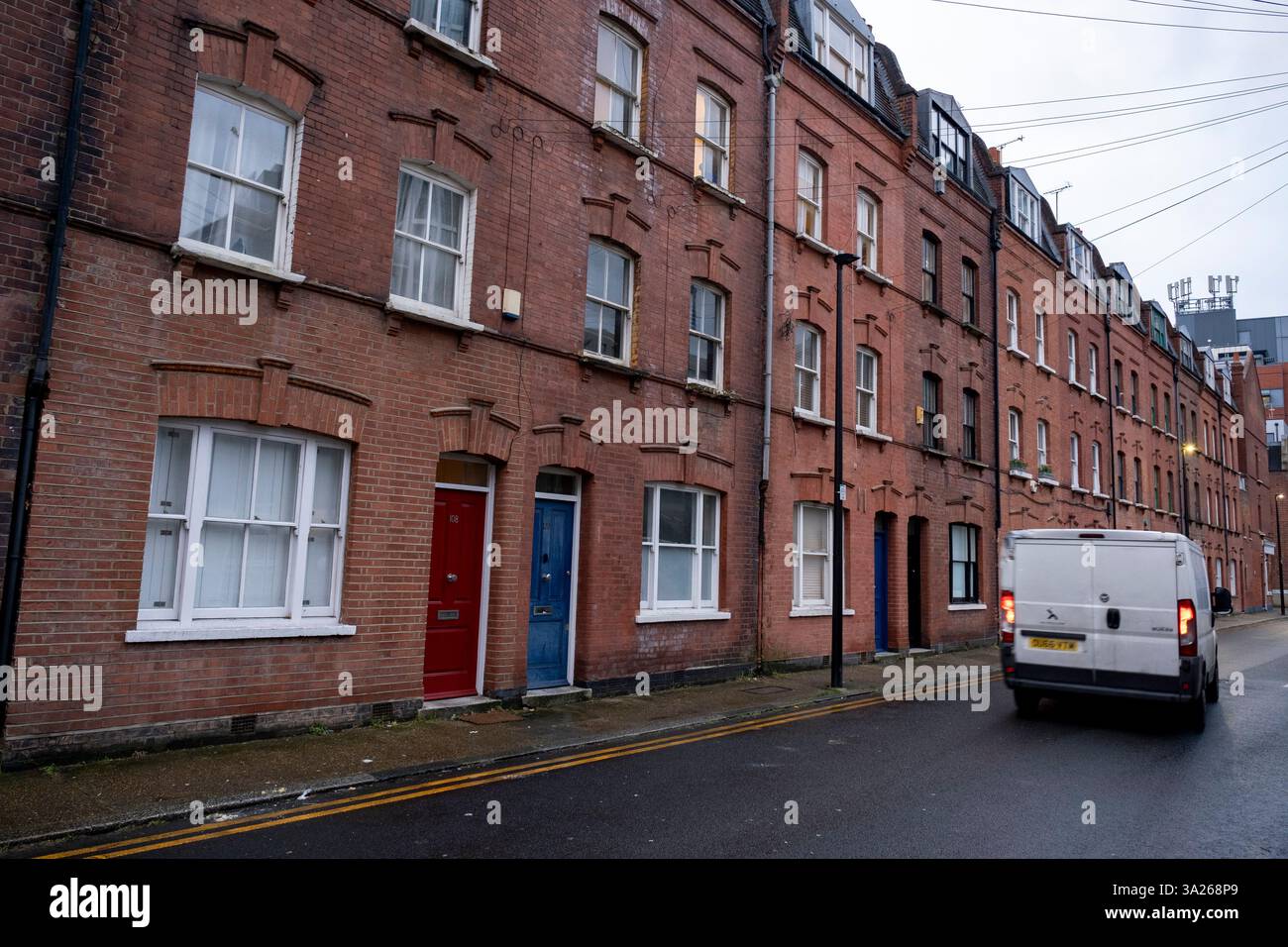 Victorian terraced red brick housing on Halcrow Street in Whitechapel ...
