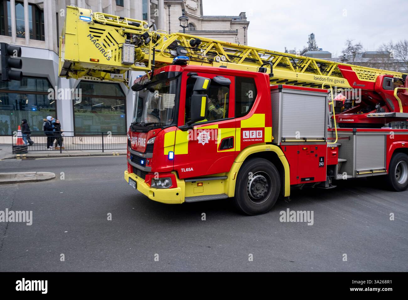 London Fire Brigade Simon Snorkel fire engine passes at speed in ...
