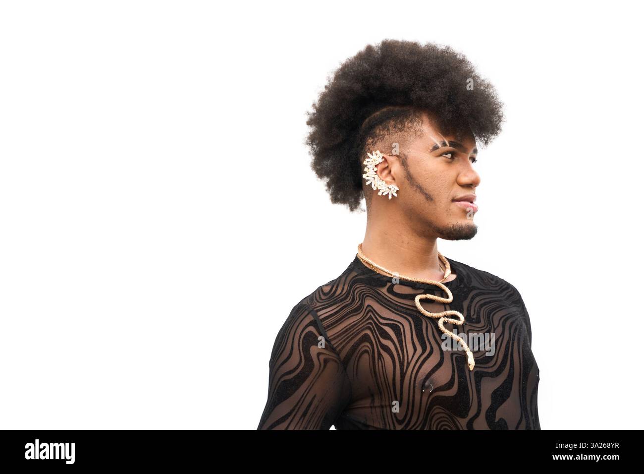 Stylish androgynous person with afro hair and unique accessories exudes ...