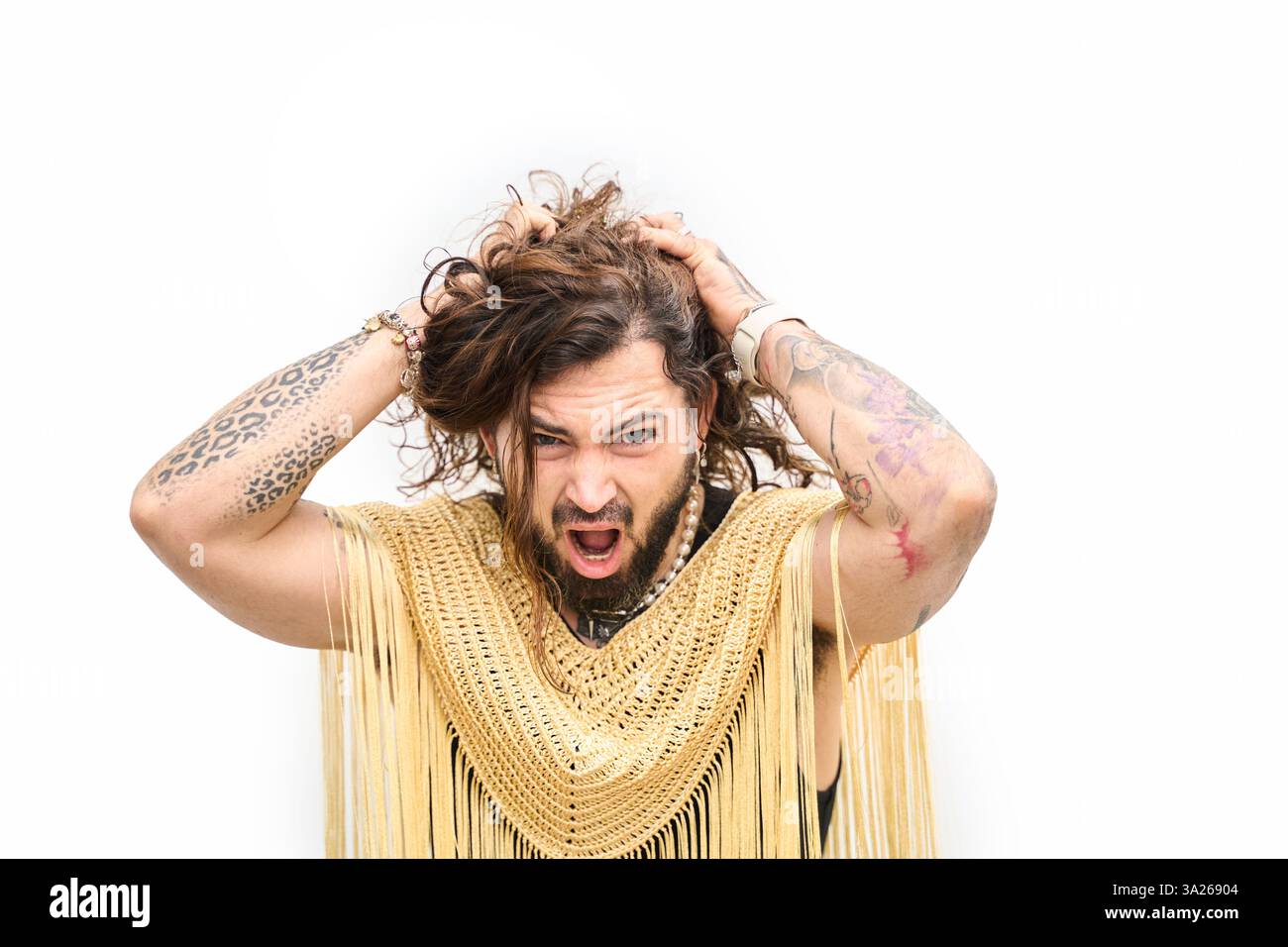 Latin transgender model pulling hair and screaming with open mouth ...