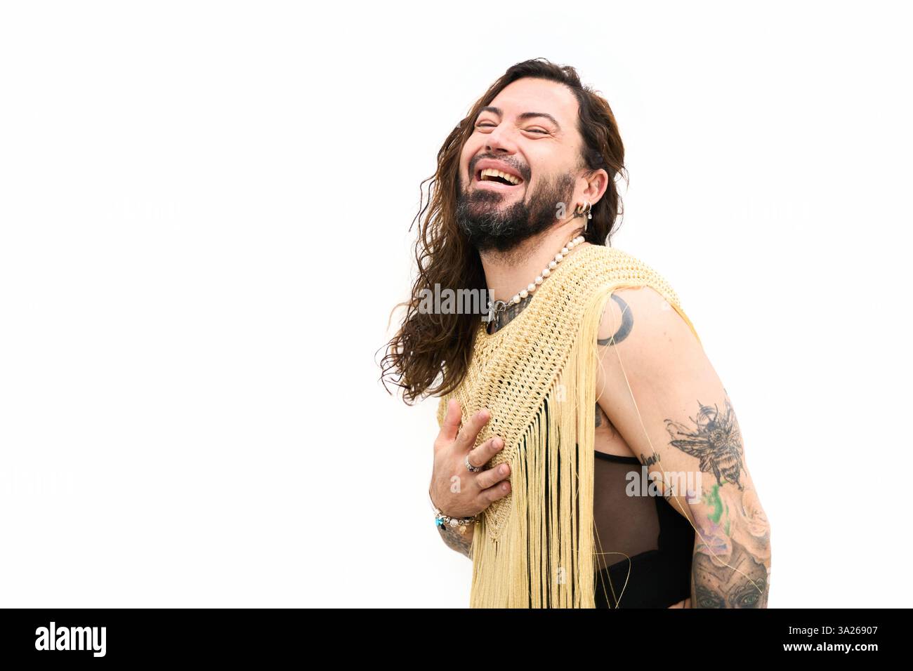 Portrait of a cheerful latin transgender person with long hair and ...