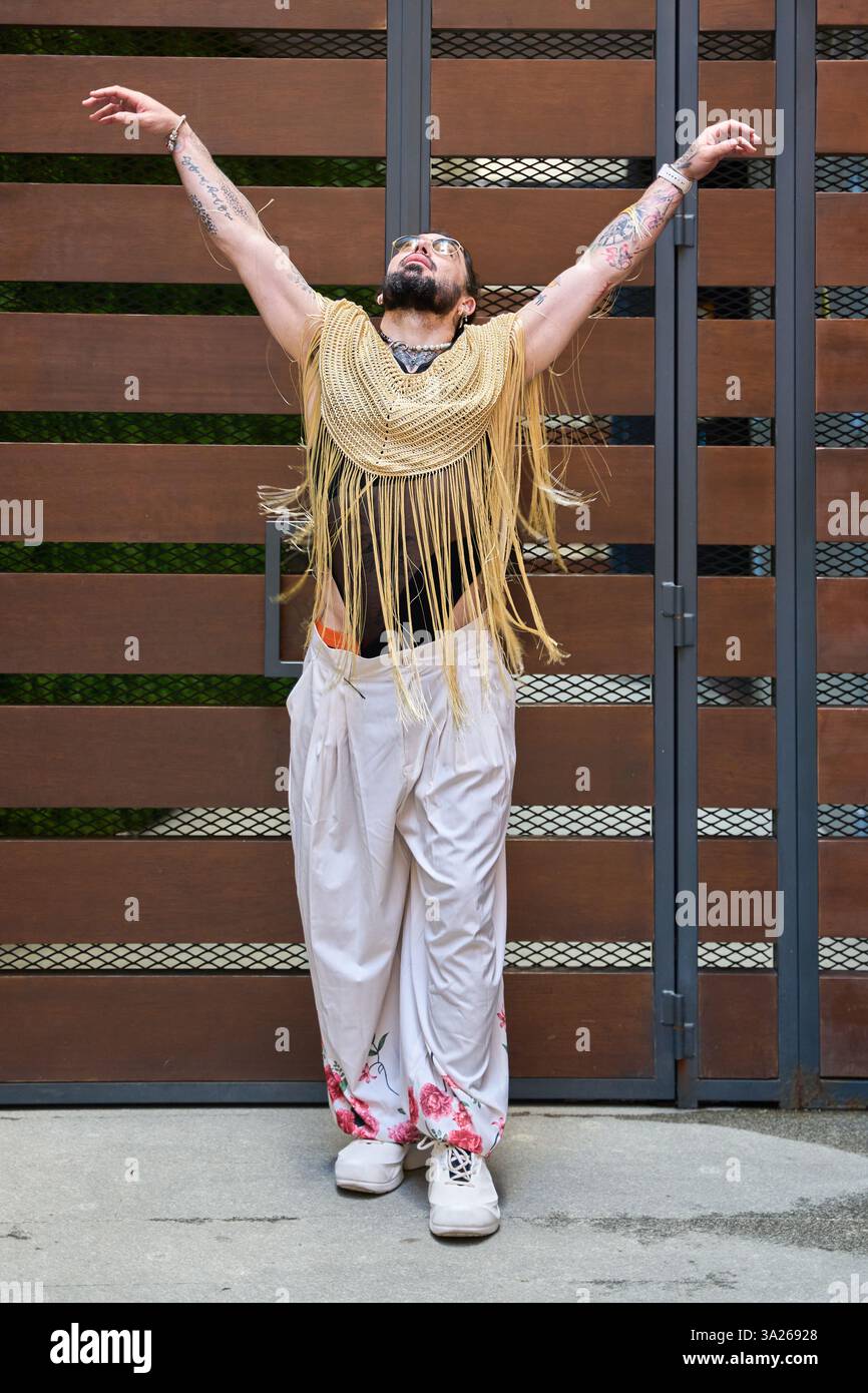 Fashionable, bearded, long haired, latin transgender model wearing a ...