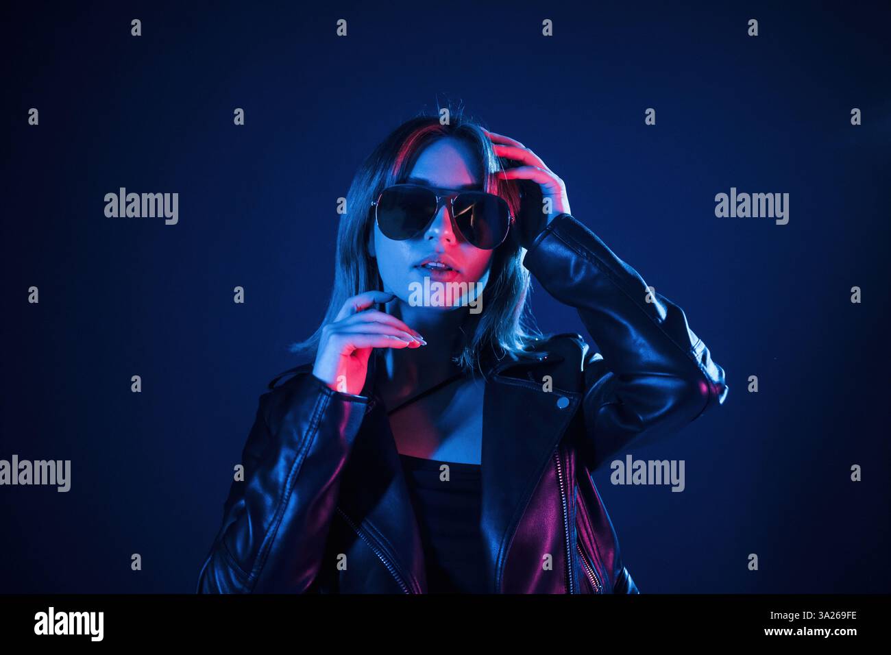 Cool young woman portrait in neon colors Stock Photo - Alamy