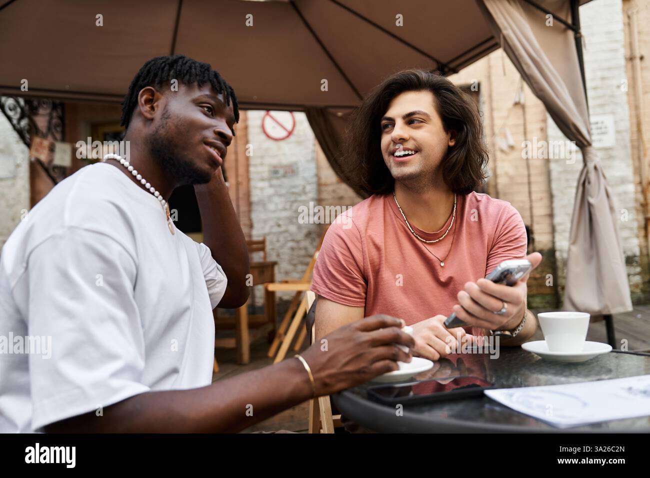 A loving couple enjoys a delightful conversation during their date at a ...