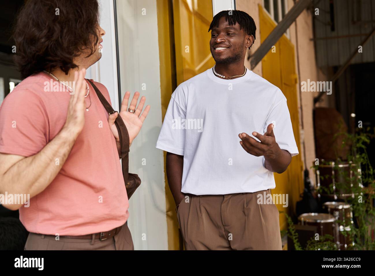 Two handsome men share laughter and joy while enjoying their date at a ...