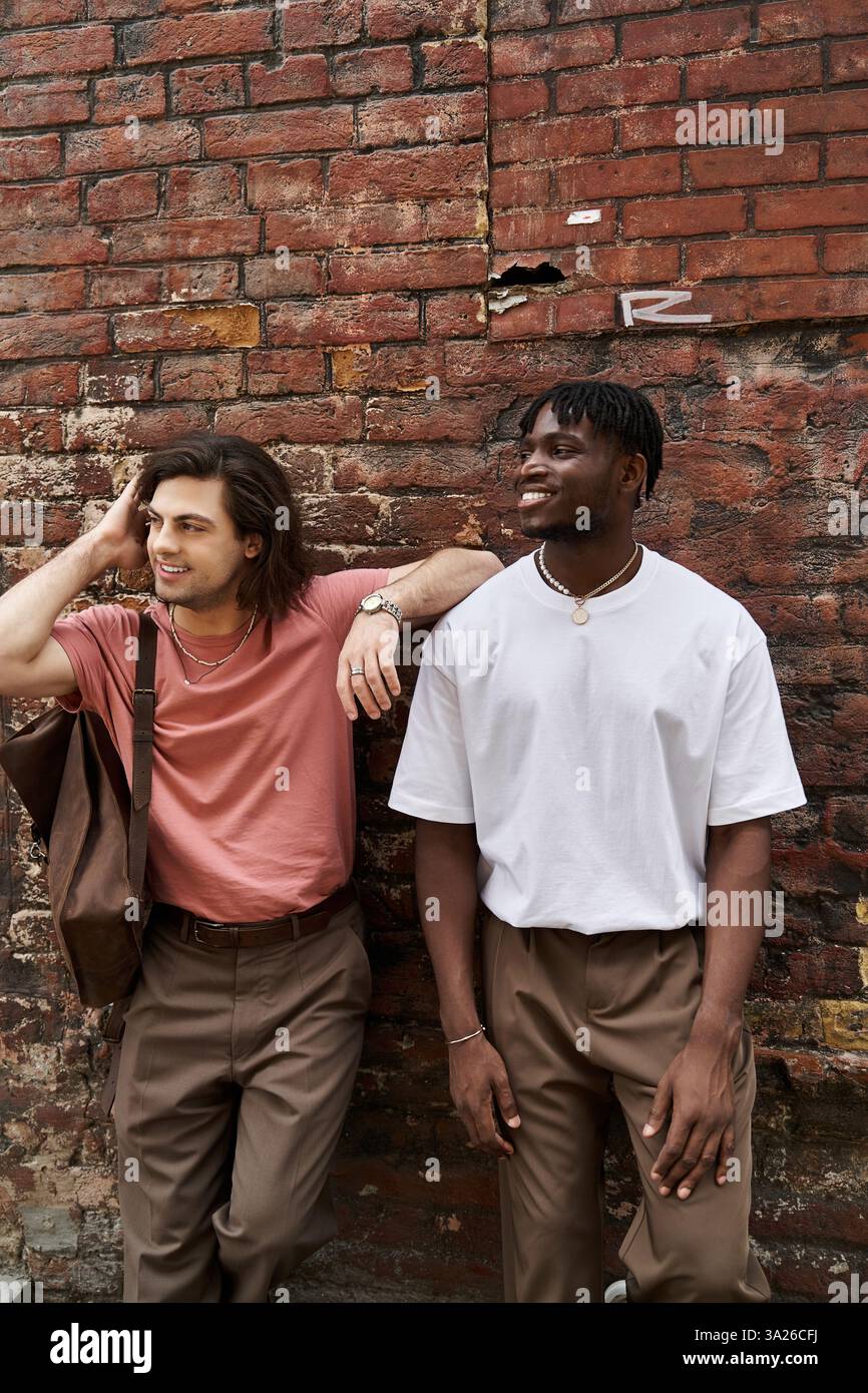 Two handsome men enjoy each others company while relaxing at a quaint ...