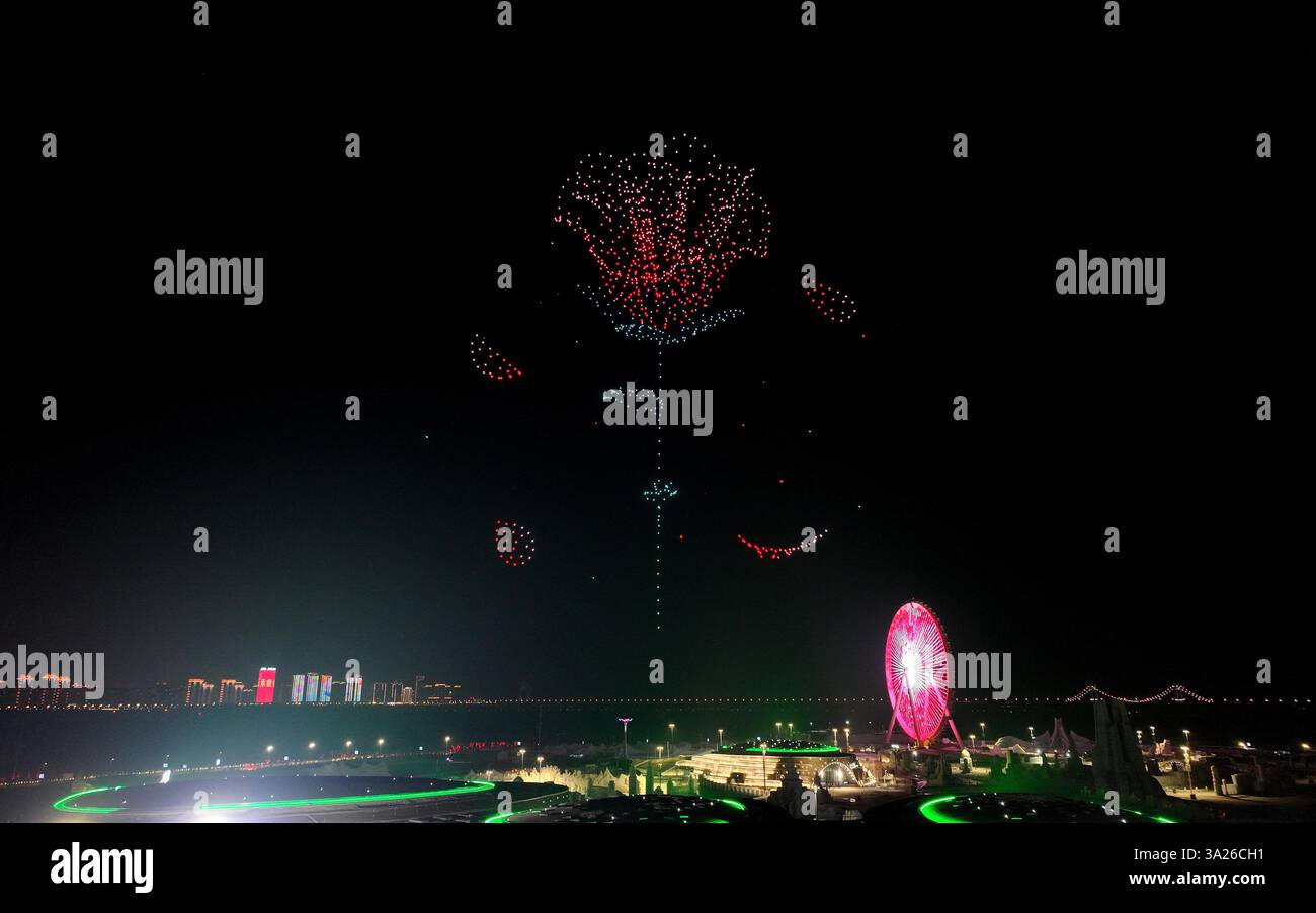 A drone light show is staged ove the Harbin Ice and Snow World in ...