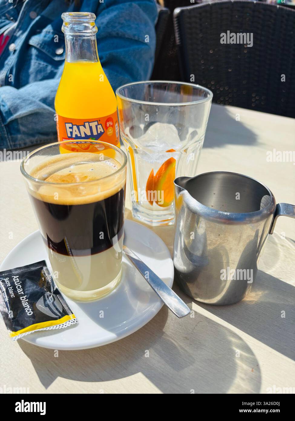 Cafe bonbon and a fanta in the sun Stock Photo - Alamy