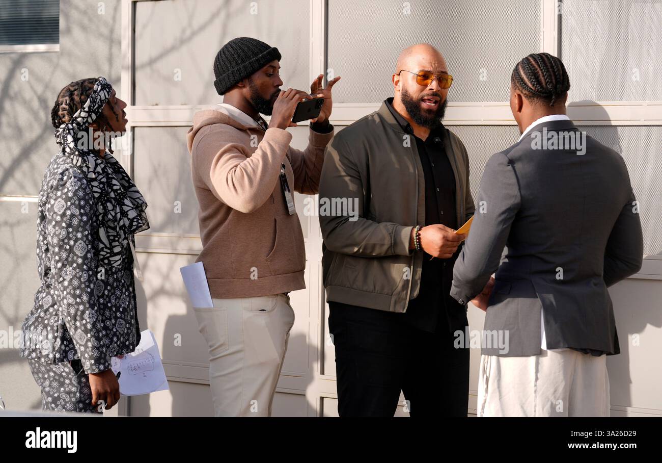 Retired NFL player T.J. Wright, left, and current NFL player Charles Harris, second from left ...