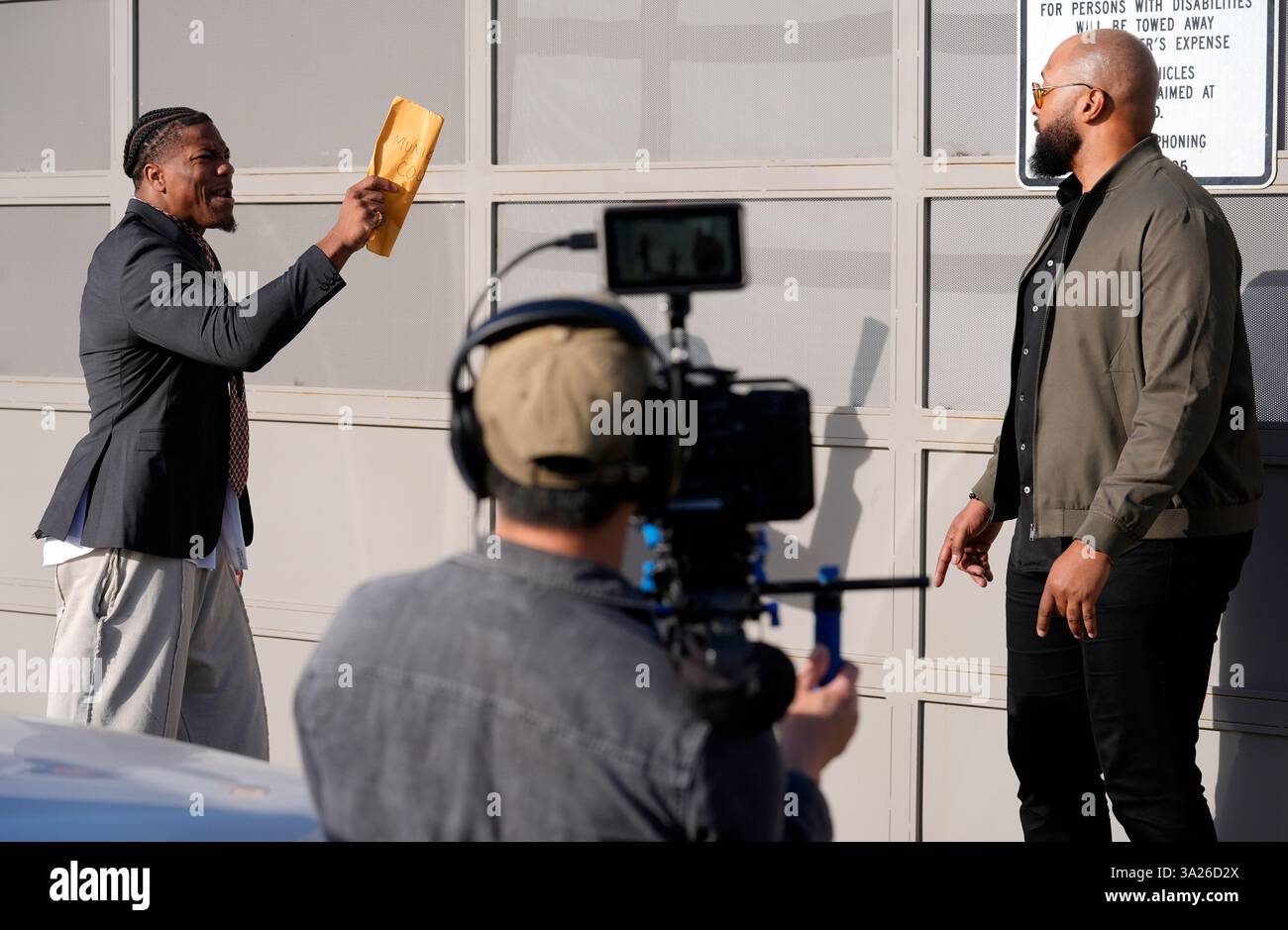 Daiyan Henley, left, a linebacker for the San Diego Chargers, acts out ...