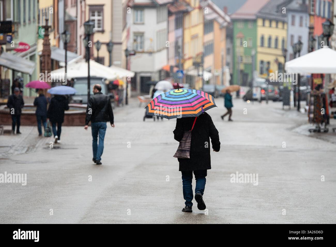 12 March 2025, Baden-Württemberg, Rottweil: A man walks through the ...