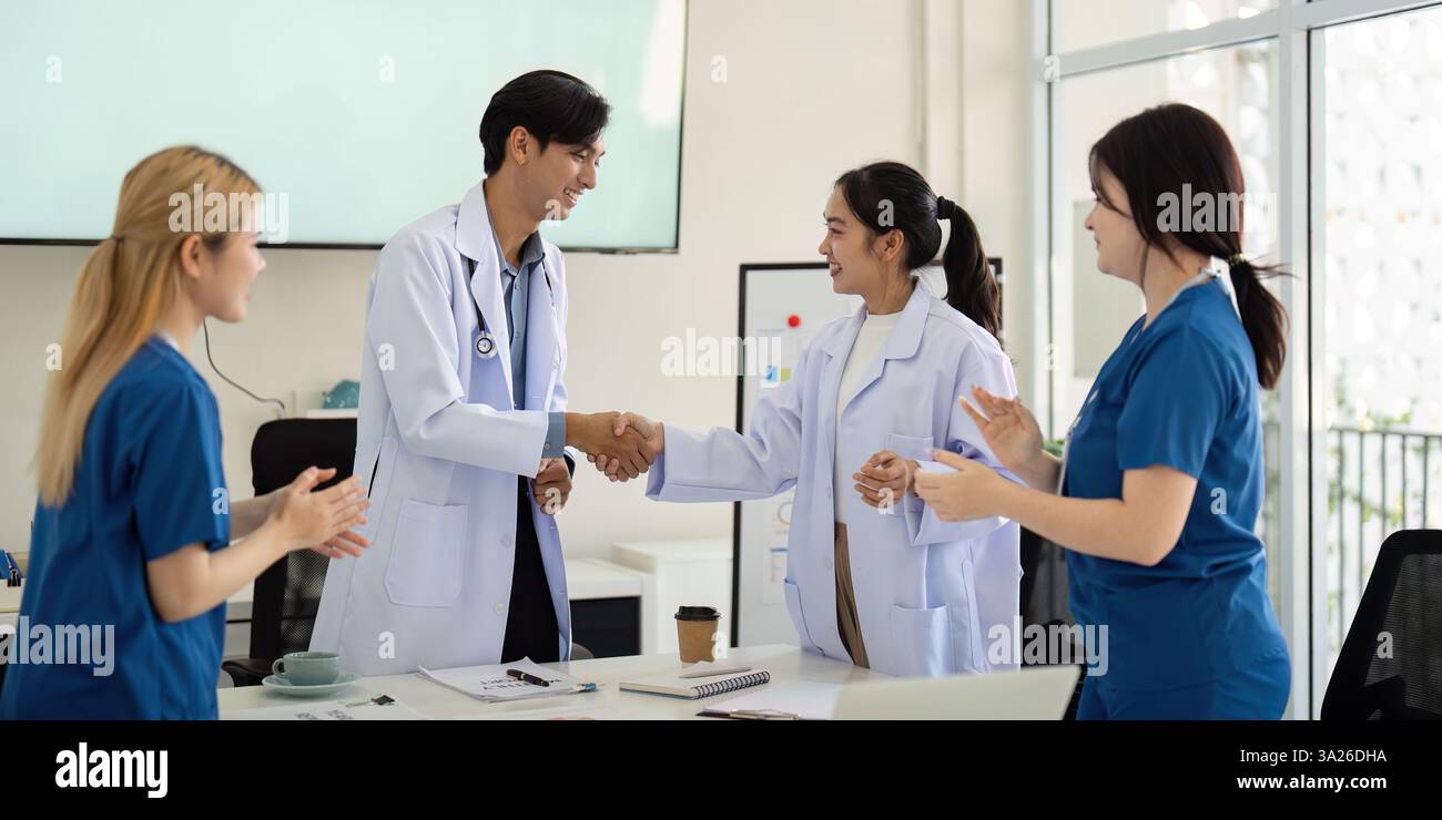 Professional handshake in healthcare. Medical team celebrating ...