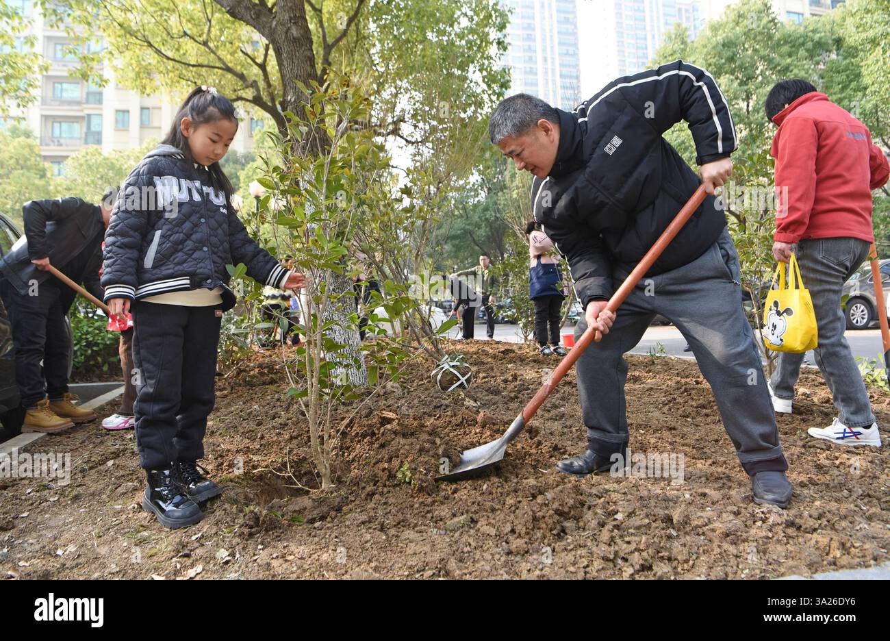 Children and parents plant trees in Huainan City, east China's Anhui ...