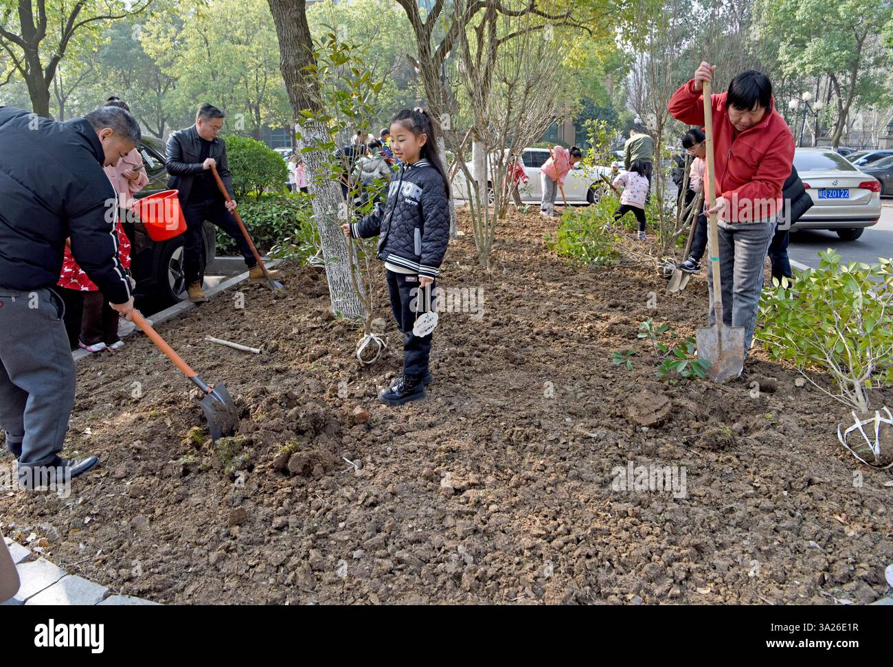 Children and parents plant trees in Huainan City, east China's Anhui ...