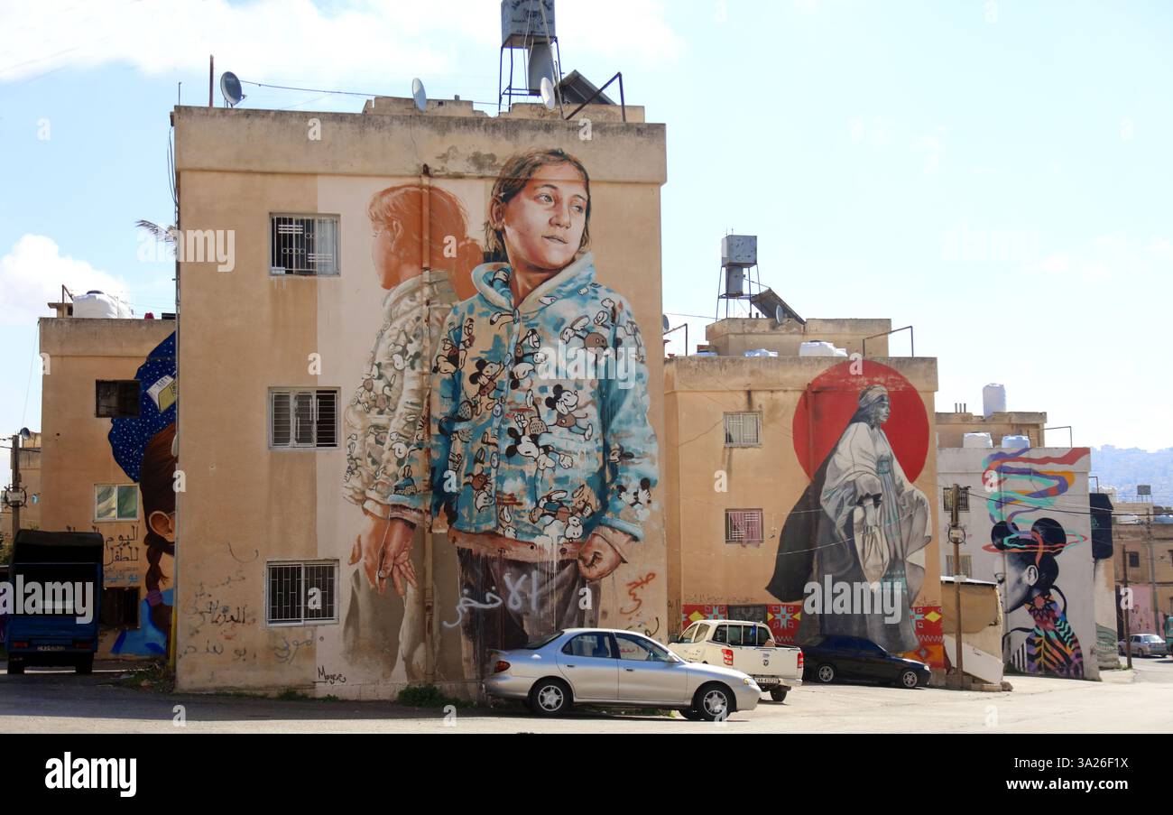 Graffiti on buildings in a working-class neighborhood in the capital ...