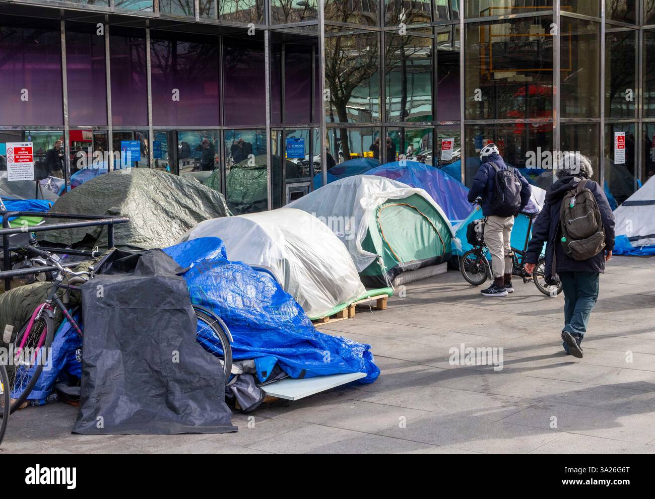 Homeless people seeing in tents at Euston. Well over 12,000 people are ...