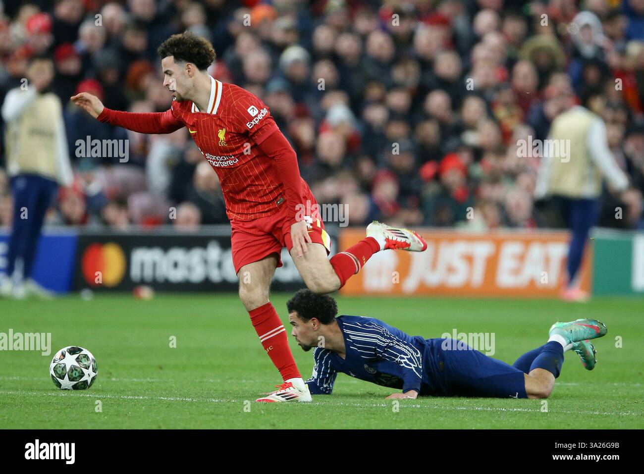 Liverpool, UK. 11th Mar, 2025. Curtis Jones of Liverpool and Warren ...
