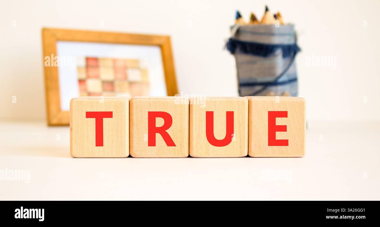 True symbol. Concept word True on beautiful wooden blocks. Beautiful ...