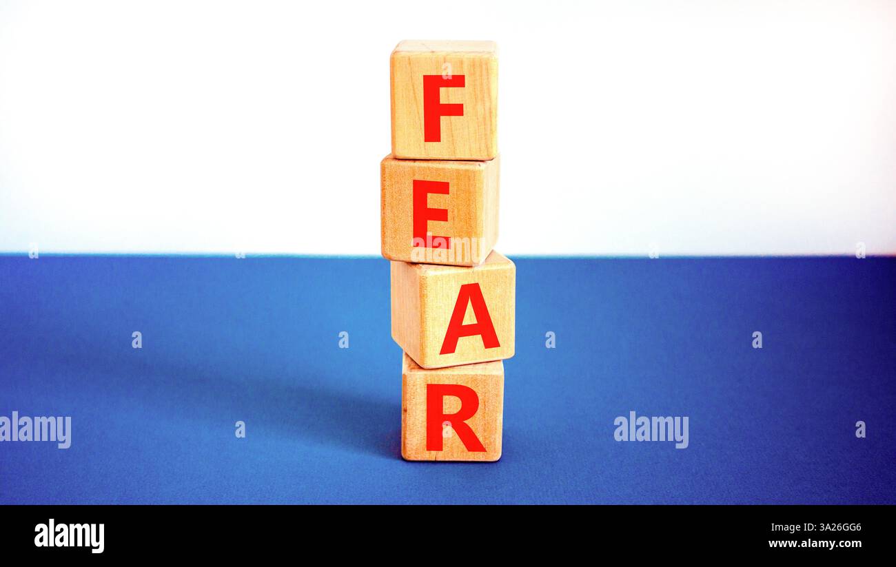 Fear symbol. Concept word Fear on beautiful wooden blocks. Beautiful ...