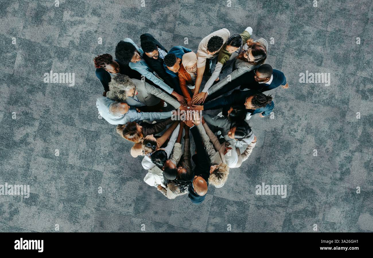 A diverse business group standing in a heart formation, symbolizing ...