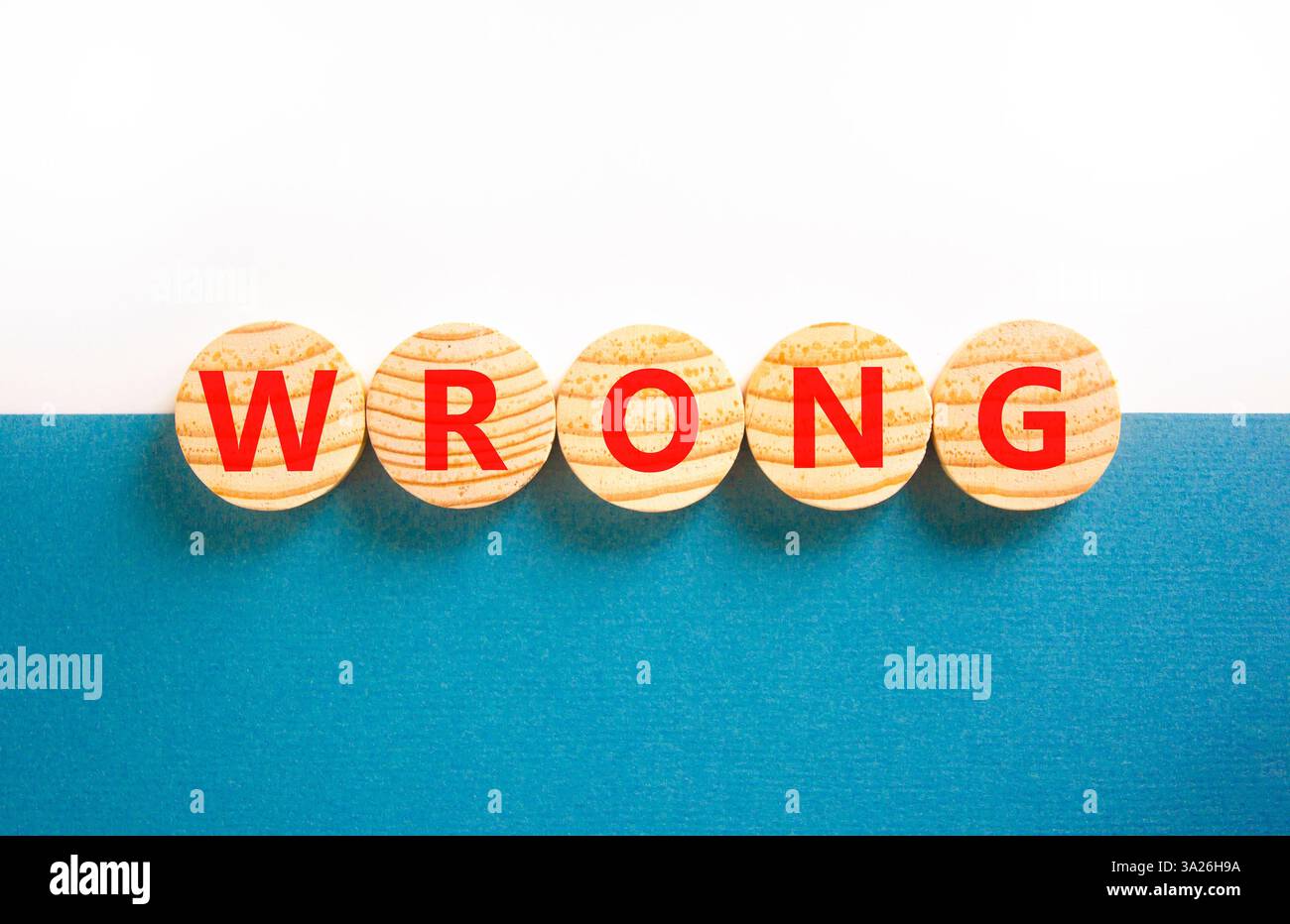 Wrong symbol. Concept word Wrong on beautiful wooden circles. Beautiful white and blue ...