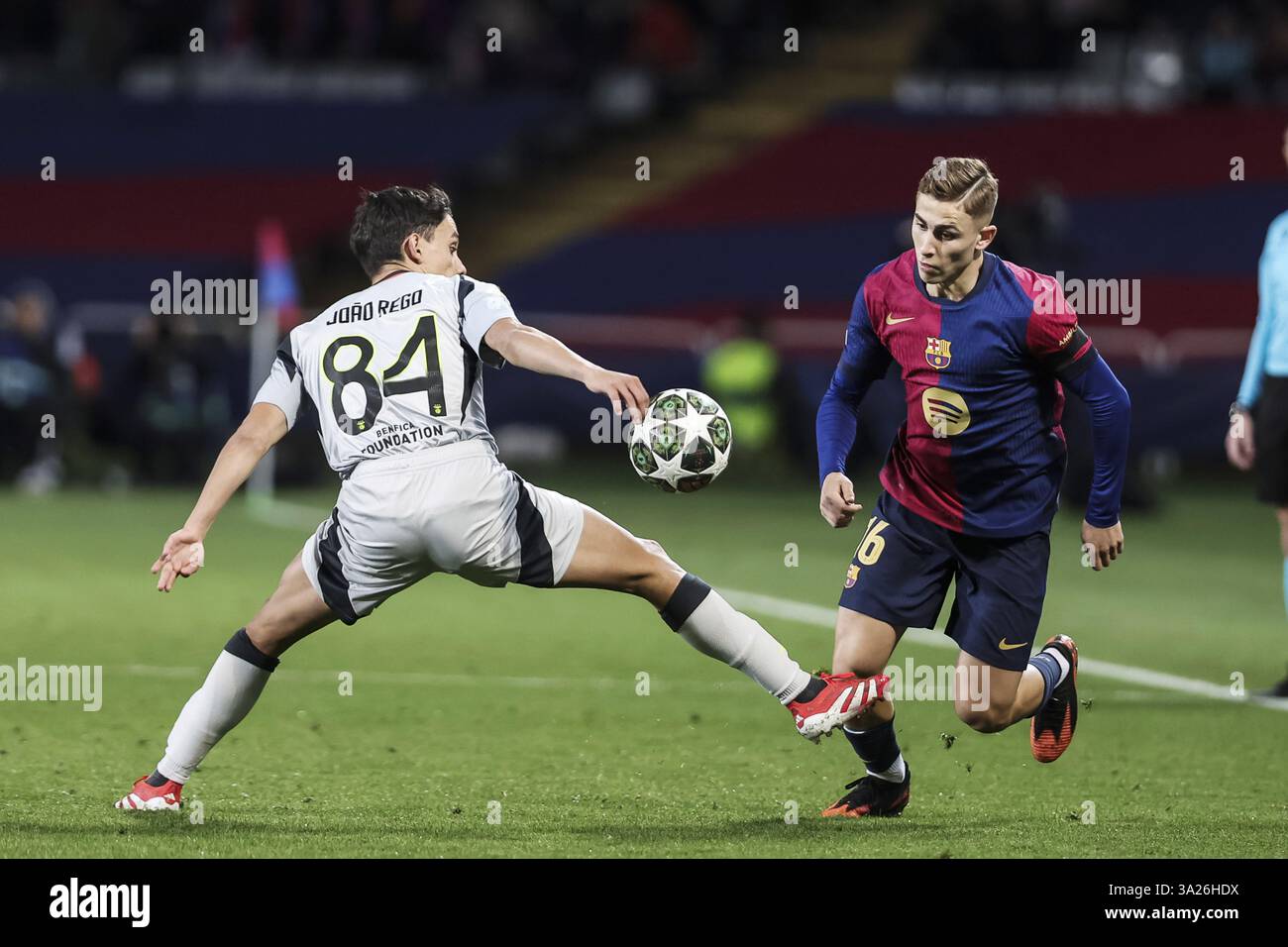 Fermin Lopez of FC Barcelona and Joao Rego of SL Benfica during the ...