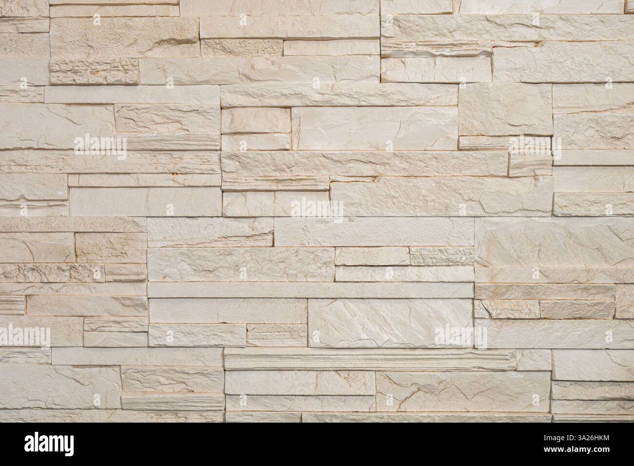 Textured Stone Wall With Beige Tiles in Horizontal Layers for ...