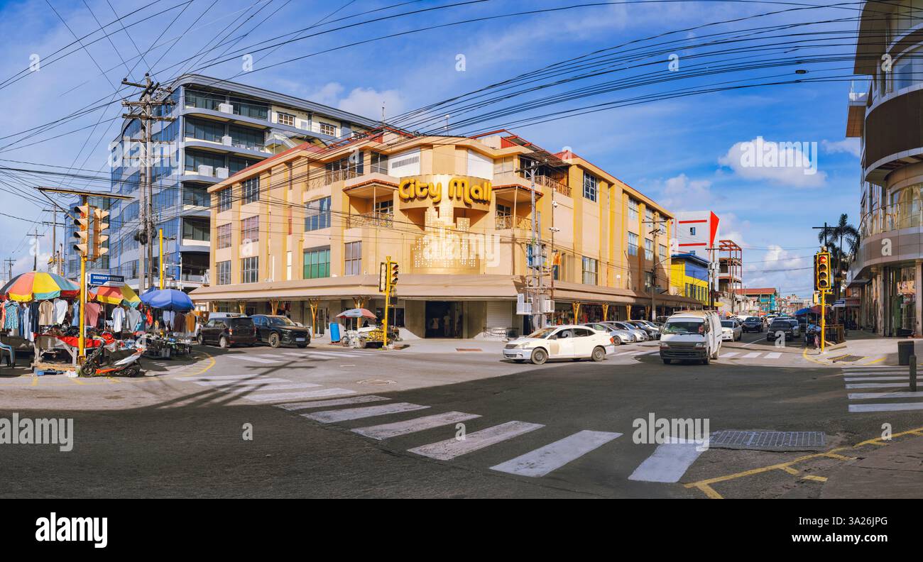 Bustling street scene in Georgetown, Guyana, with City Mall, colorful ...