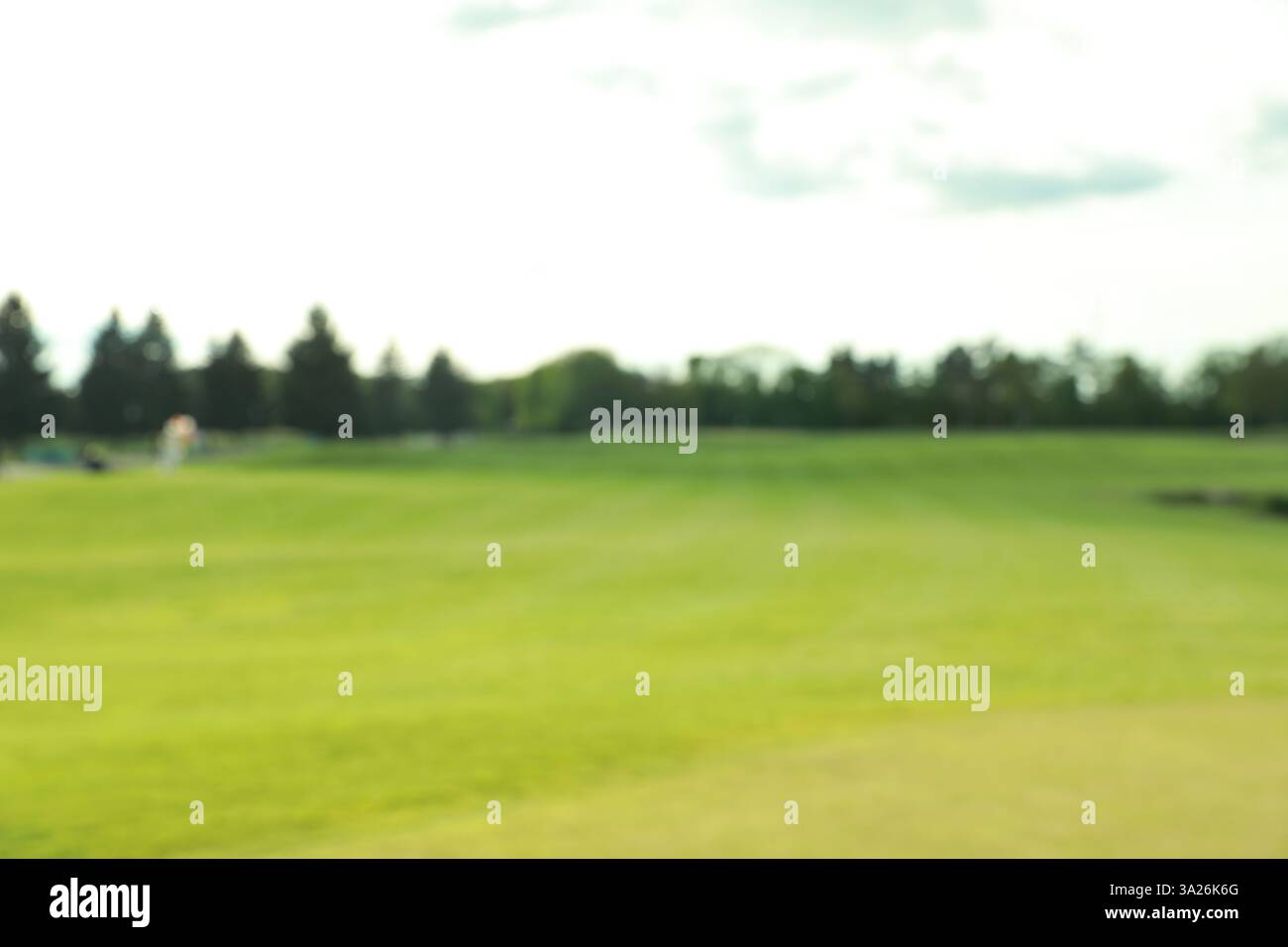 Blurred view of golf course on sunny day Stock Photo - Alamy