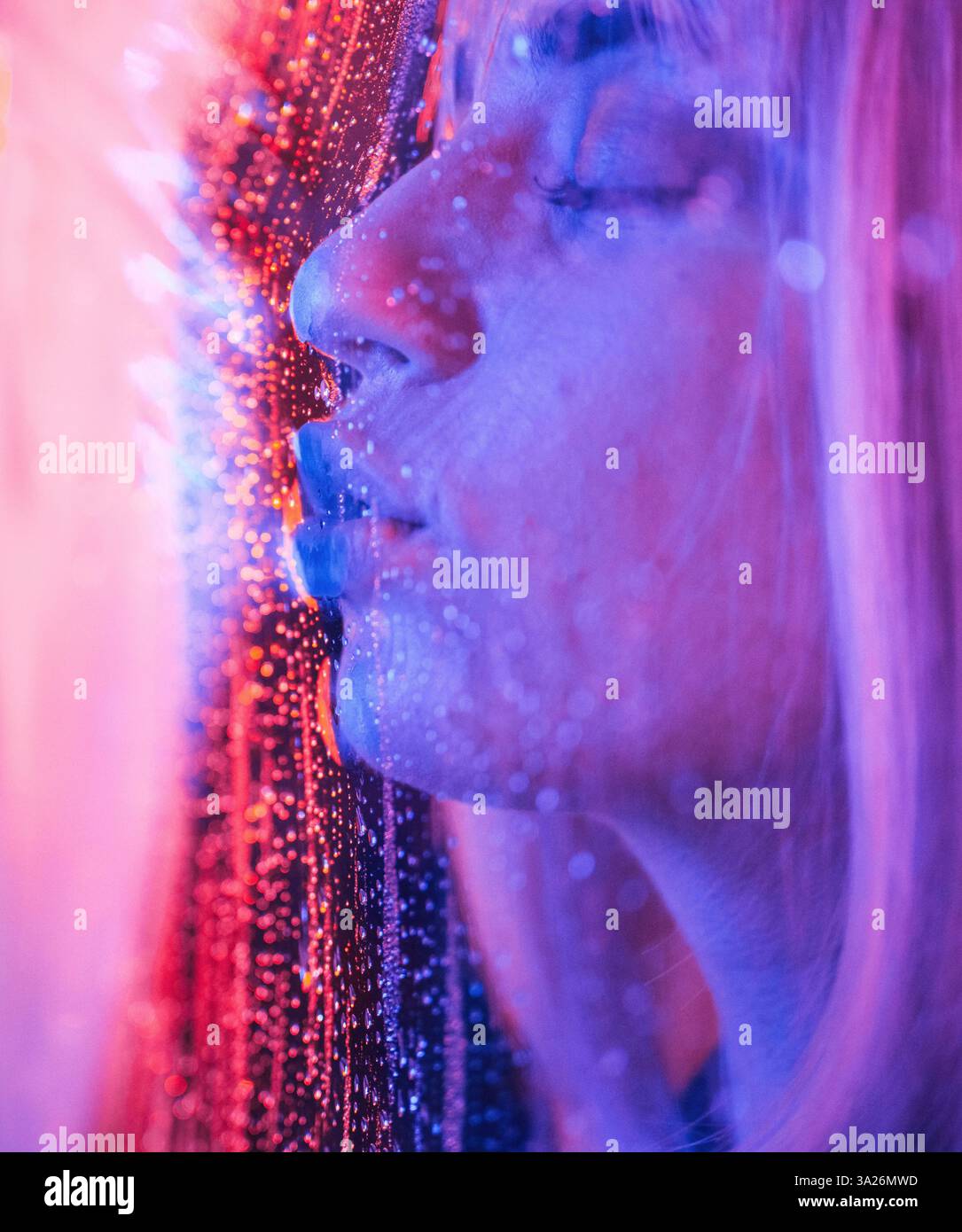 Kissing the surface. Stylish woman with white hair is behind wet ...