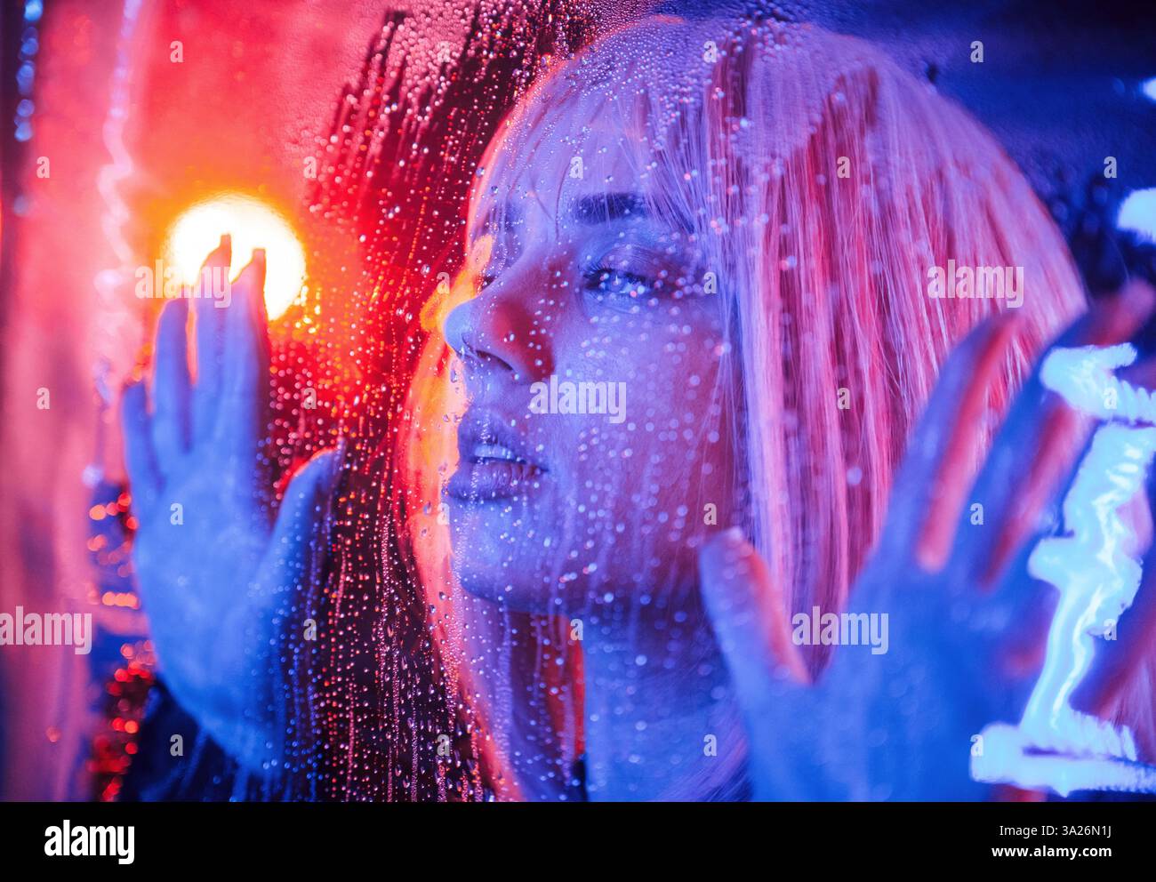 Focused close up view. Stylish woman with white hair is behind wet ...