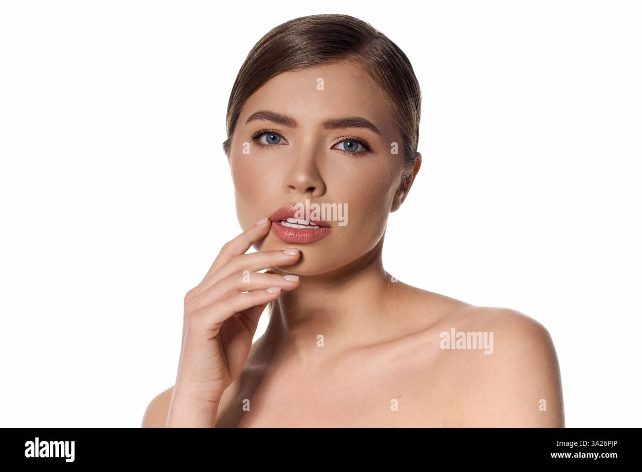 Beautiful woman with flawless skin and chic hairstyle gently touching ...