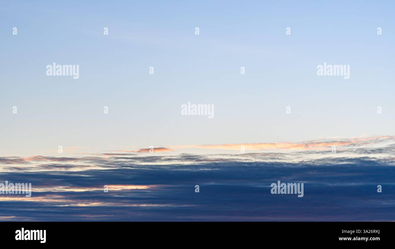 Dawn sky with a large cloud in the lower section Stock Photo - Alamy