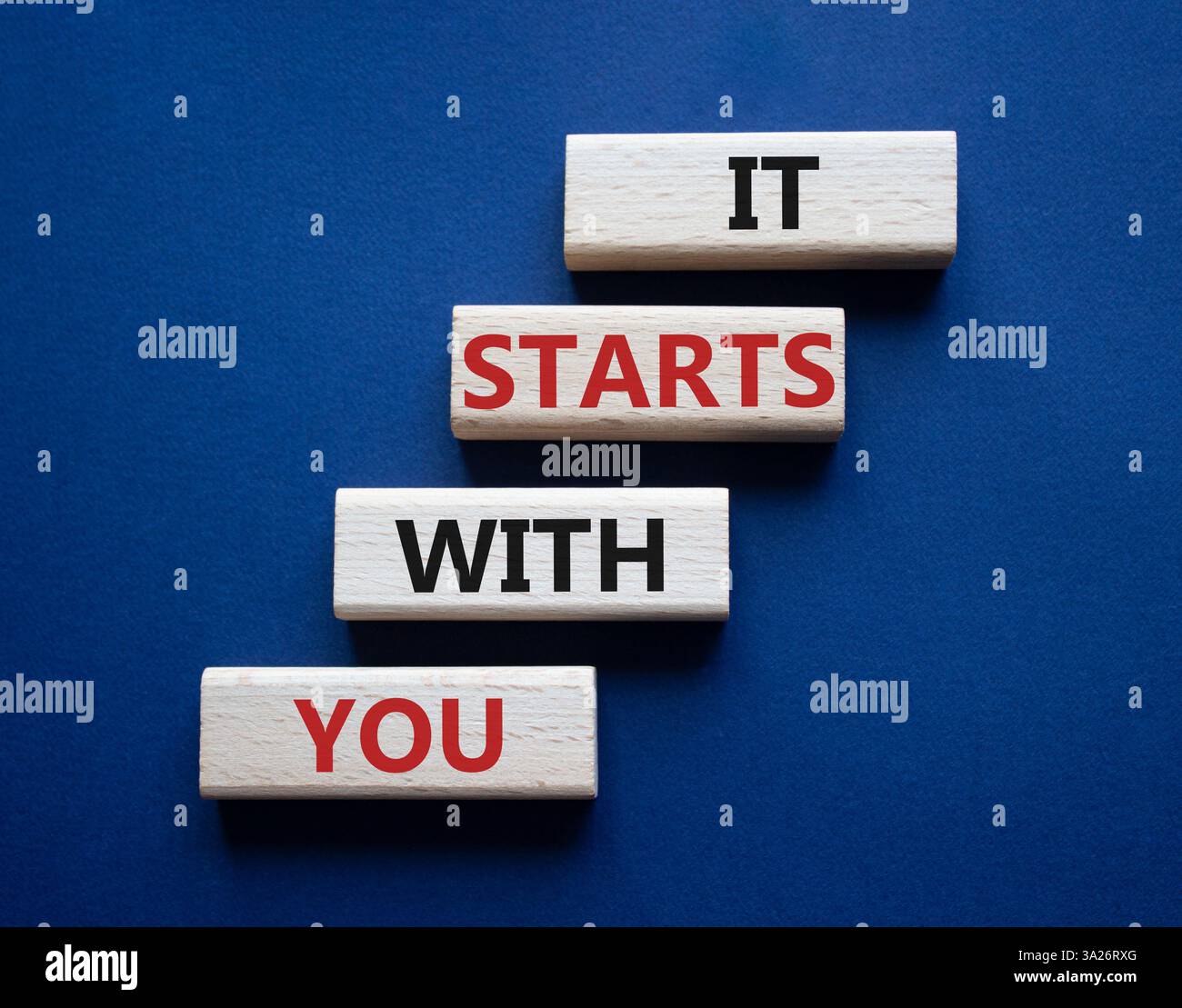 It starts with you symbol. Wooden blocks with words It starts with you ...
