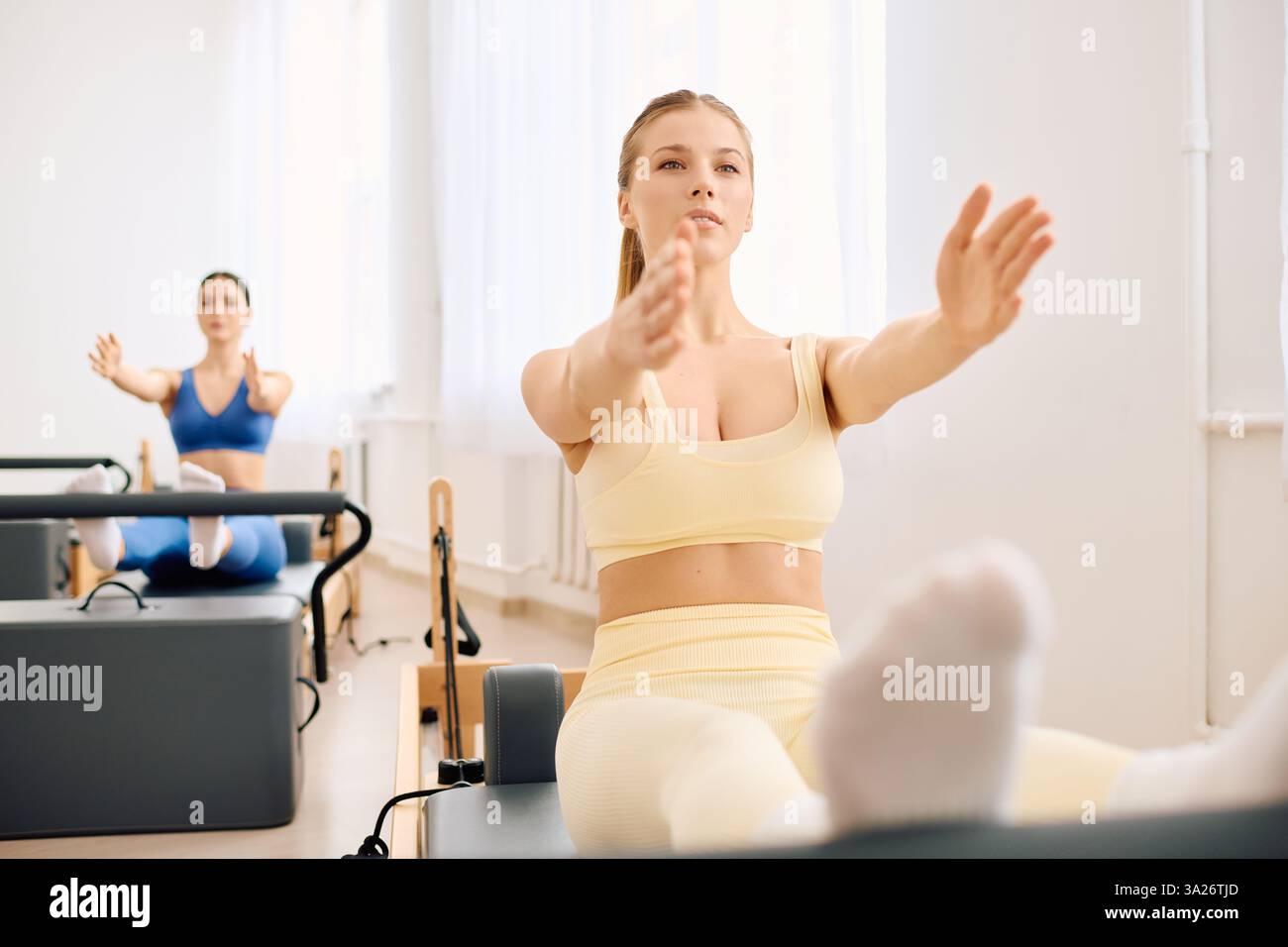 Participants focus on pilates to boost core strength and flexibility in ...