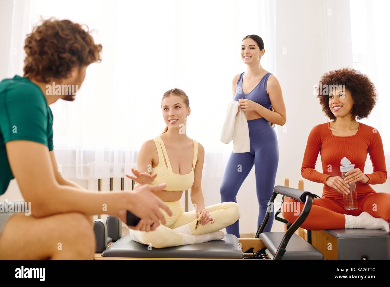 Group of women engages in conversation hi-res stock photography and ...