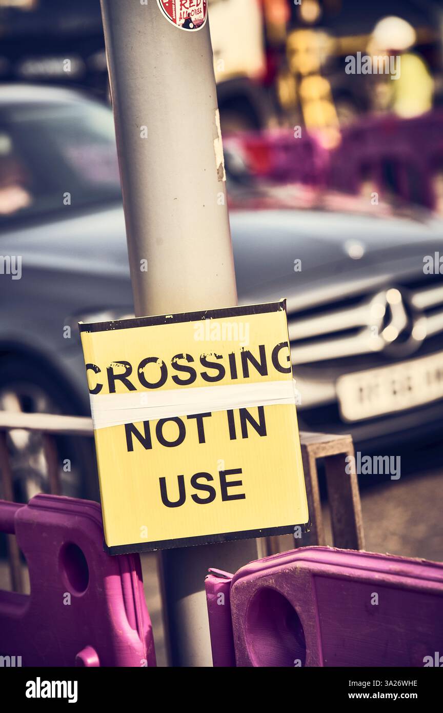 Crossing not in use sign on main road Stock Photo - Alamy