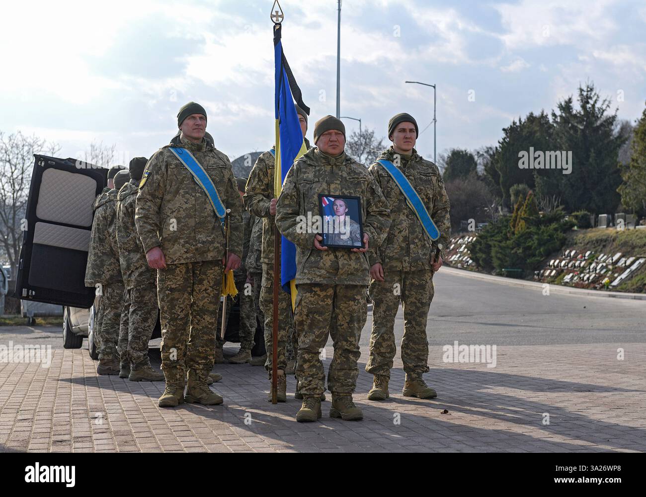 Non Exclusive: A serviceman holds a photo of Dominic Bryce Abelen, a 28 ...