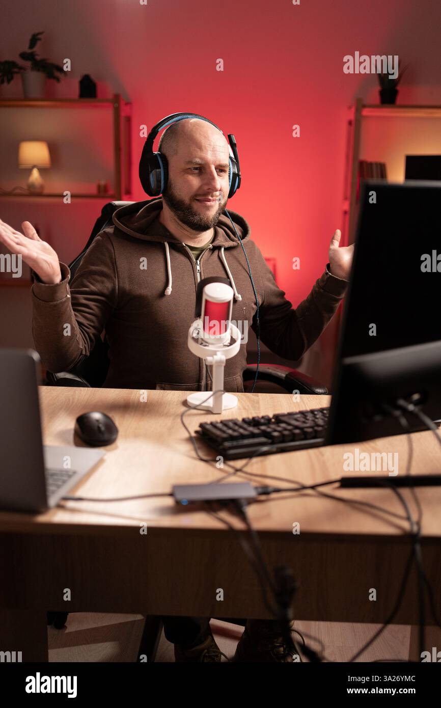 Gaming at home concept. Bearded male gamer playing online video game on ...