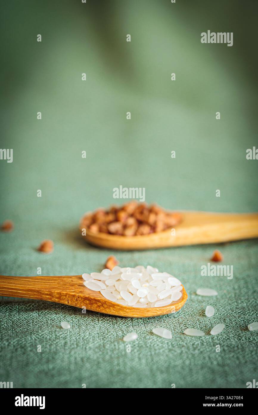 Wooden spoons filled with various grains, including rolled oats, rice ...
