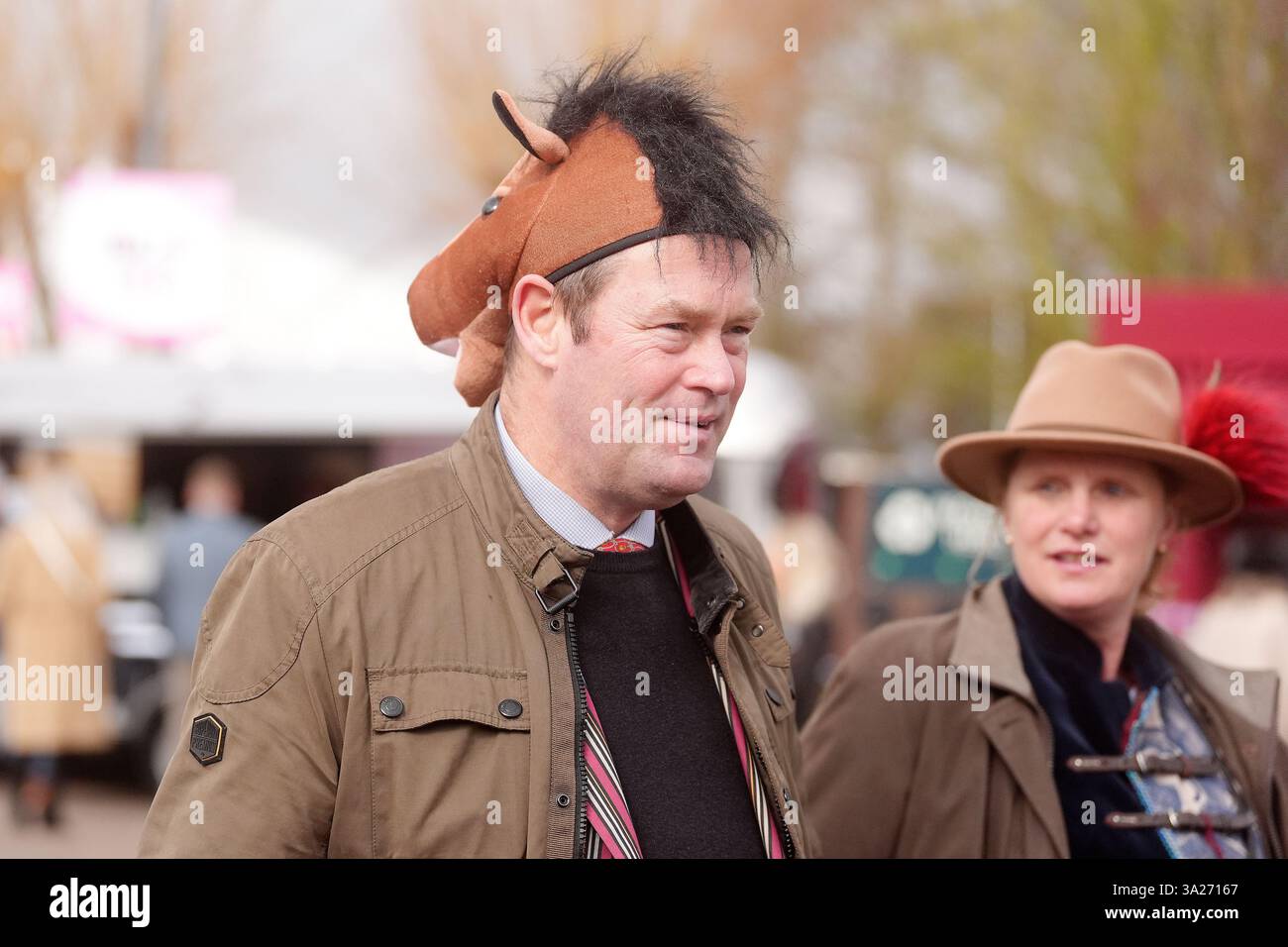 Racegoers arrive on day two of the 2025 Cheltenham Festival at ...