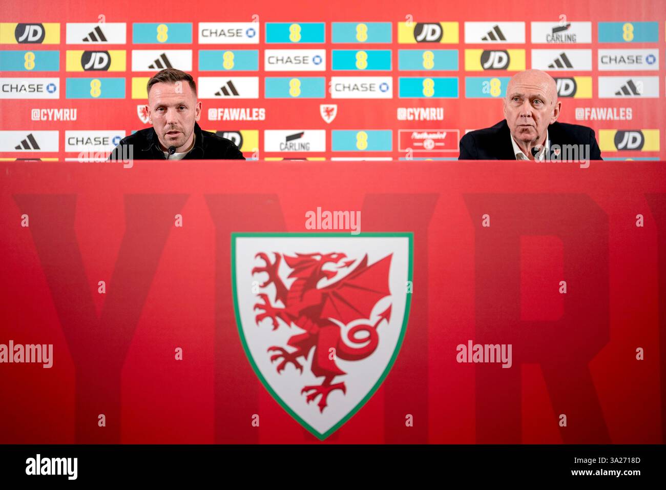 Wales head coach Craig Bellamy (left) and press officer Ian Gwyn Hughes ...
