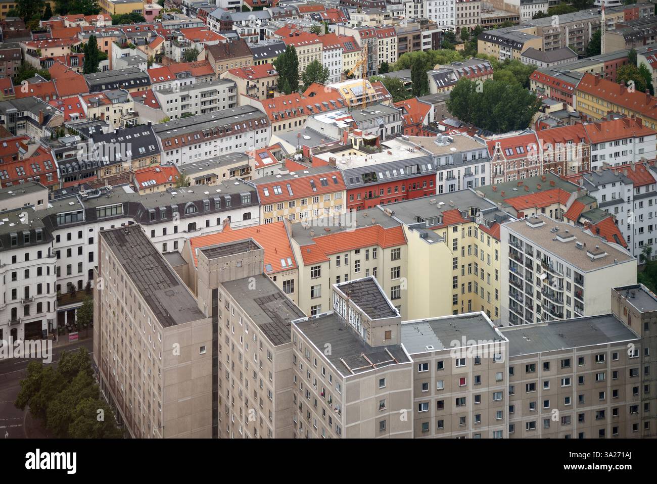 Aerial view of a European city with vibrant red-roofed buildings and ...