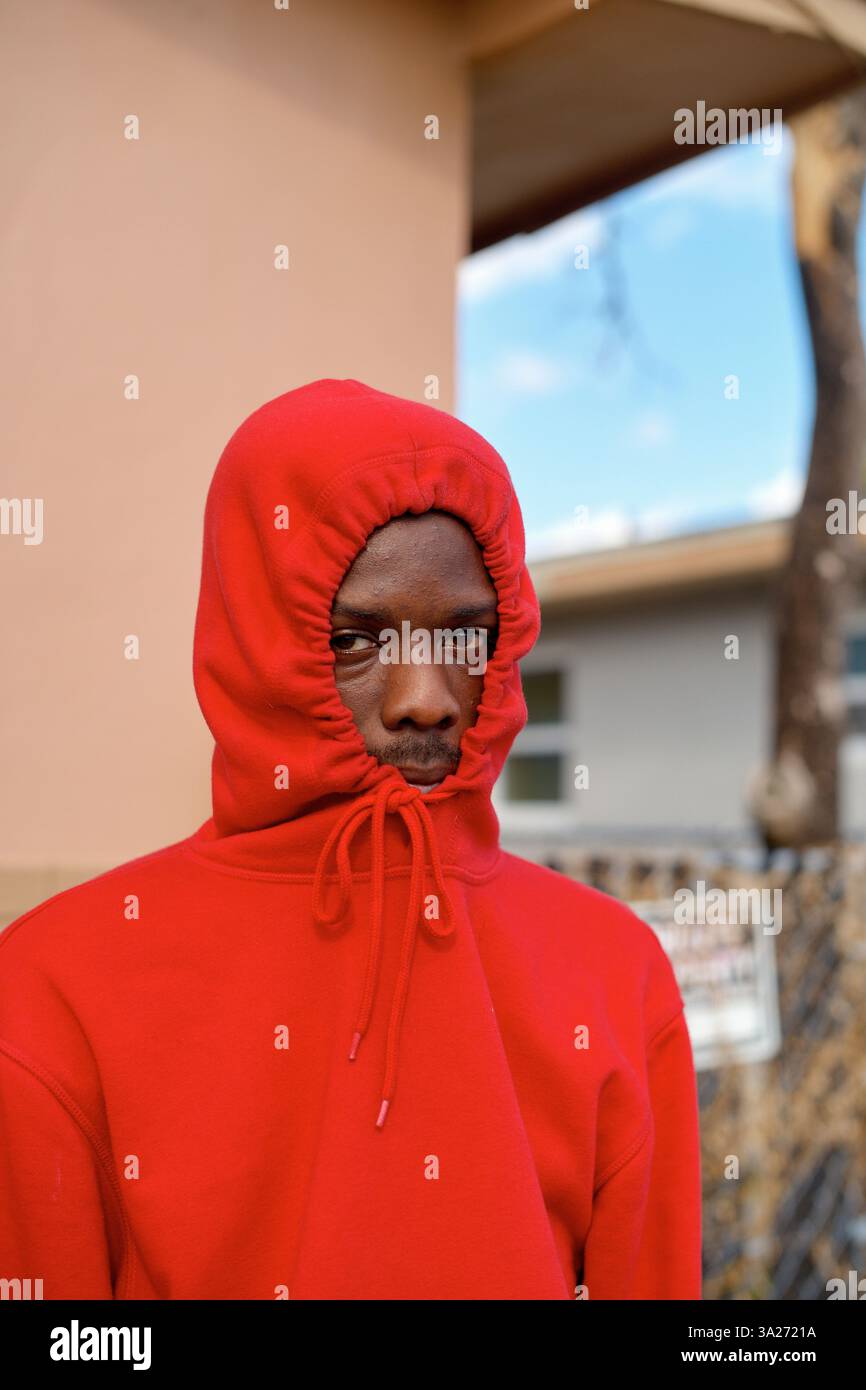 Person in red hoodie hi-res stock photography and images - Alamy