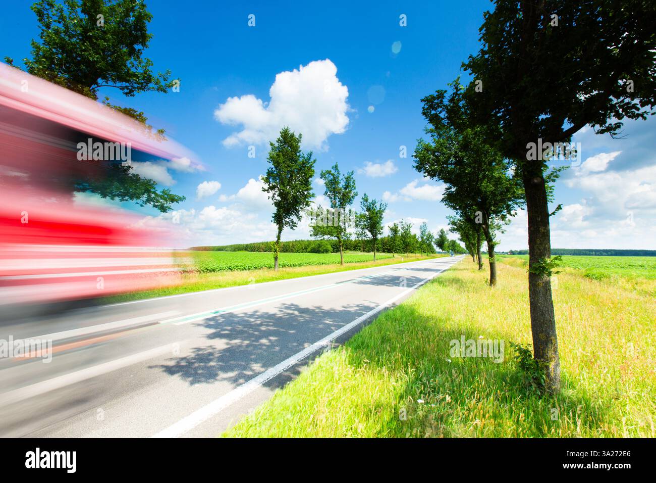 Trucks in motion driving on the highway at speed transporting cargo - a ...