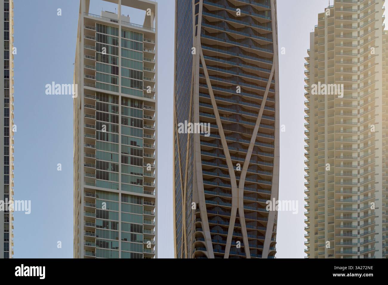 Modern high-rise buildings with unique architectural designs against a ...