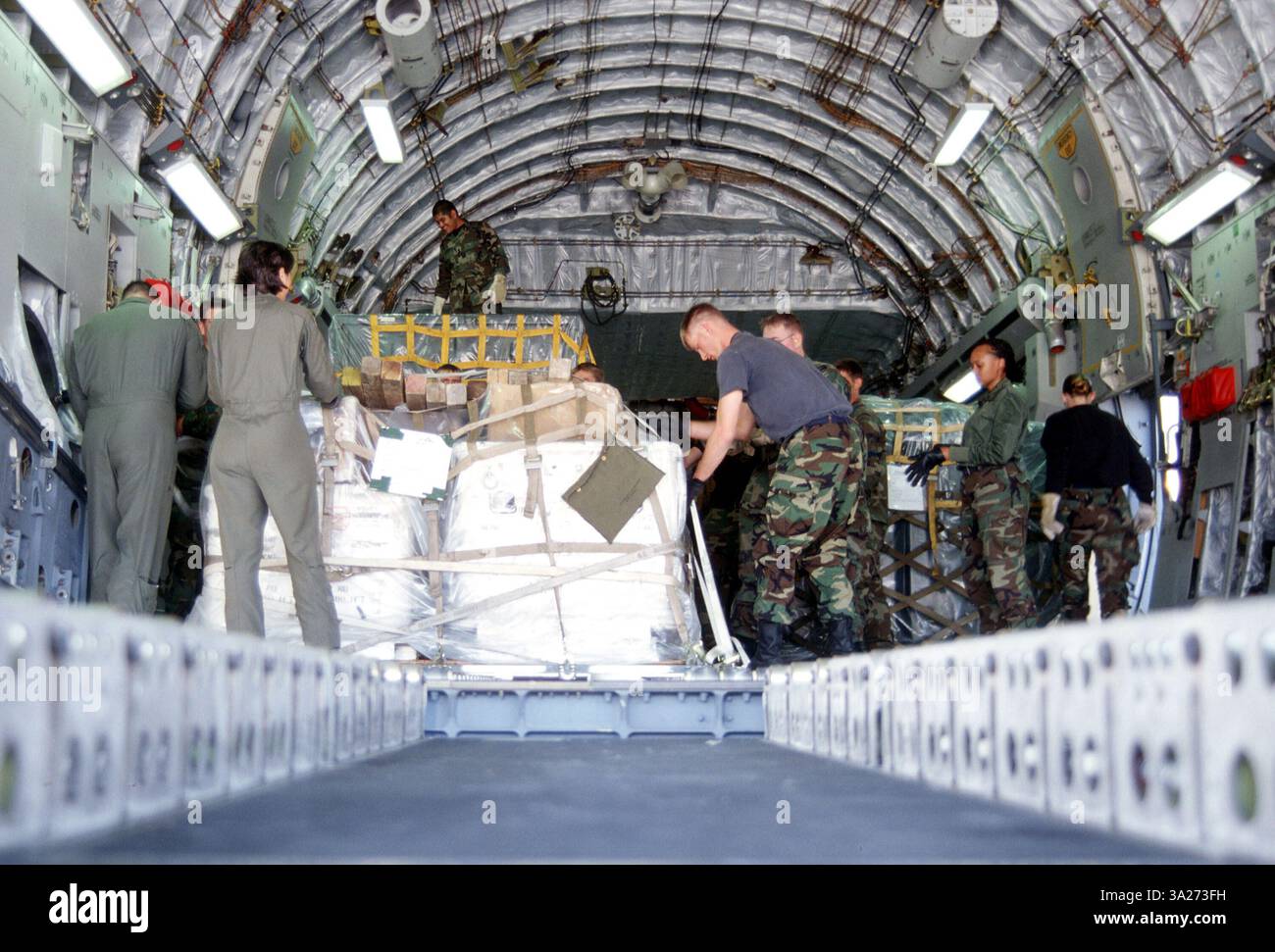 Feb 19, 1999; Holloman, NM, USA; US soldiers load a C-17 Cargo plane ...